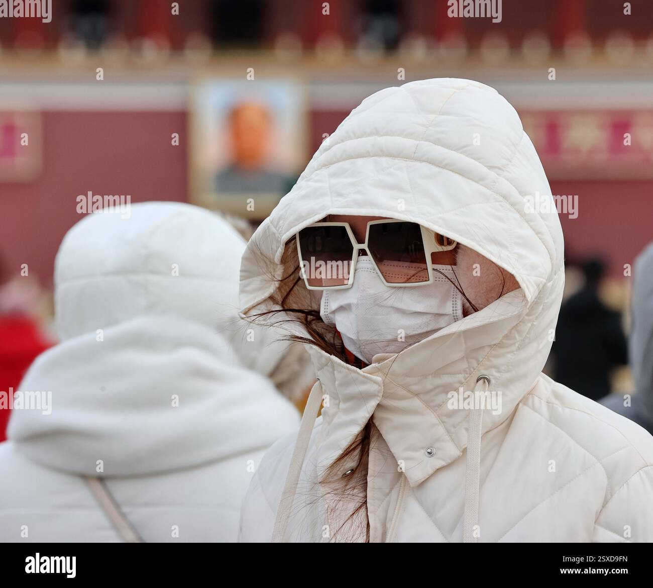 Tourists visit the Tiananmen Square amid cold air in Beijing, China, 21 ...