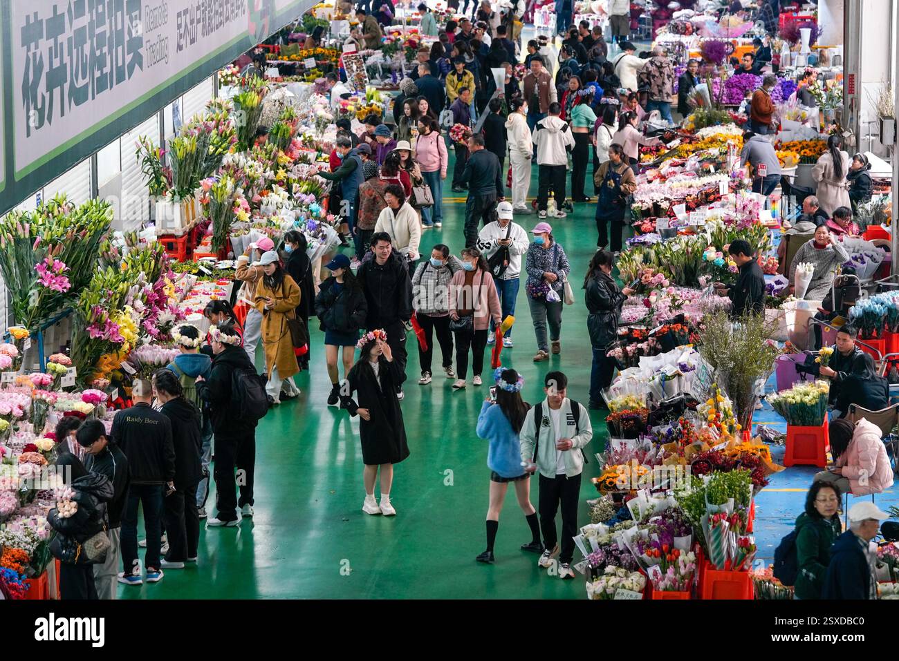 People select flowers at a flower market in Kunming City, southwest ...