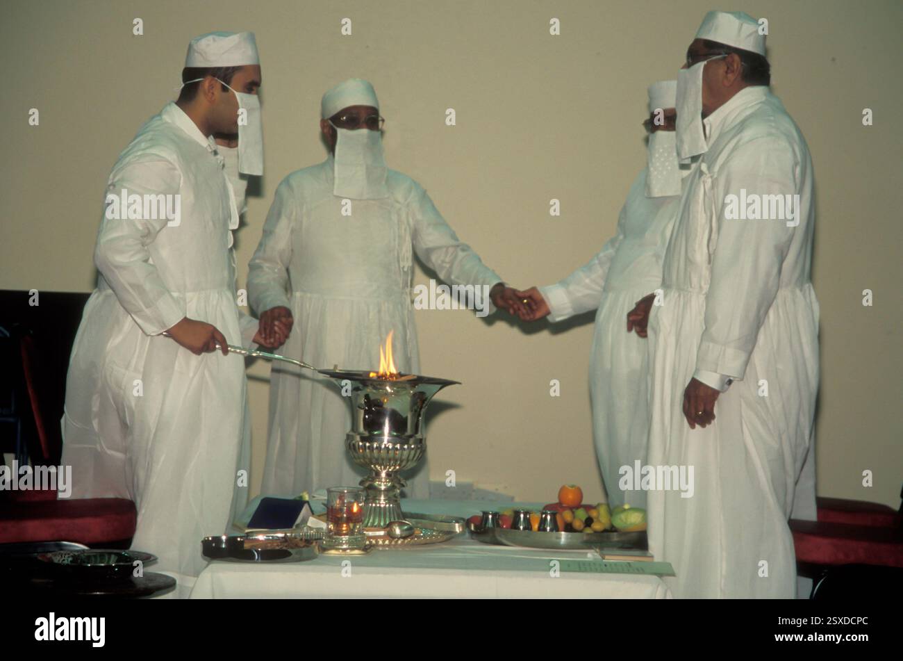 Priests burning sandalwood during the Zoroastrian Jashan ceremony Stock ...
