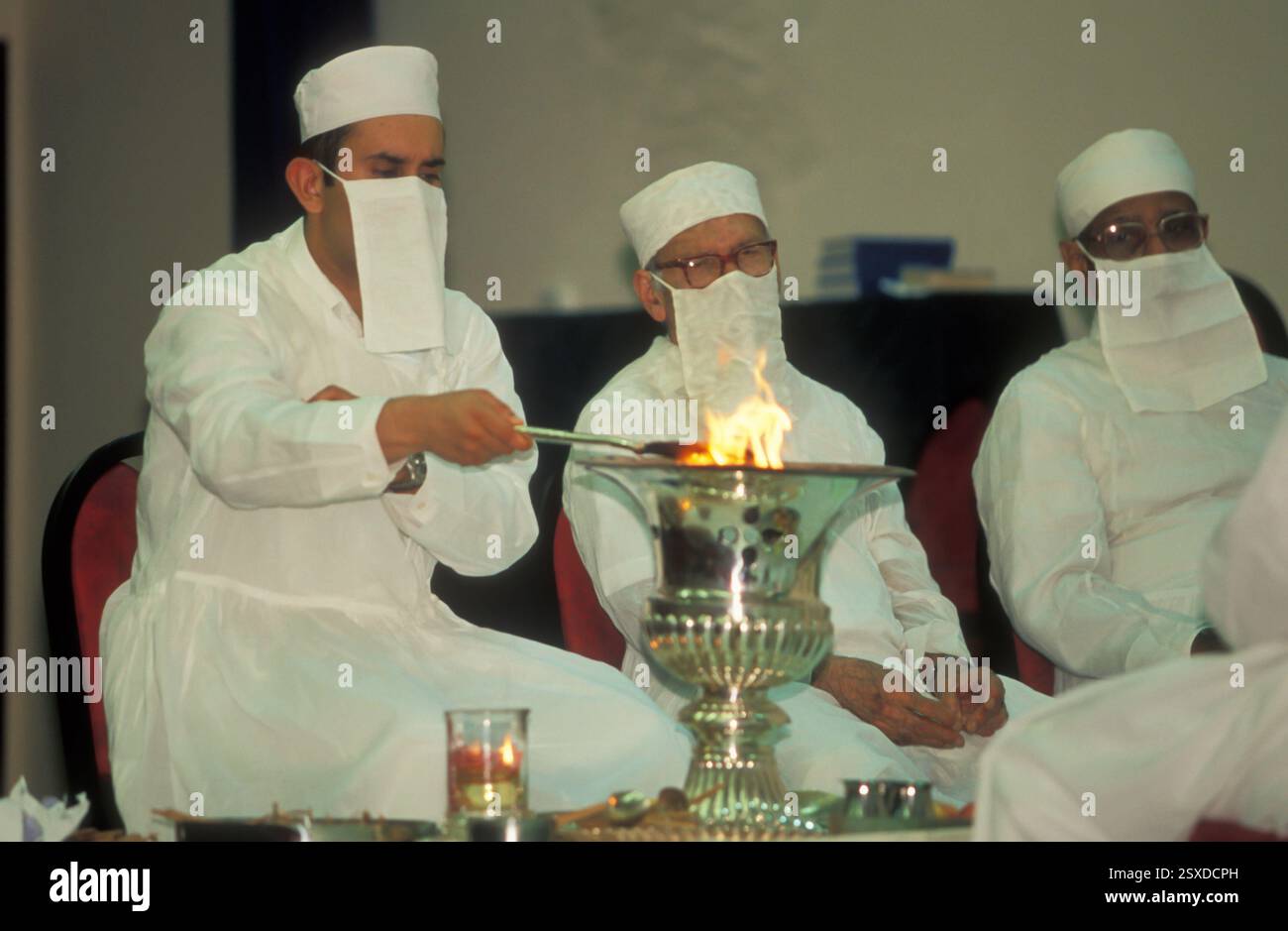 Priests burning sandalwood during the Zoroastrian Jashan ceremony Stock ...