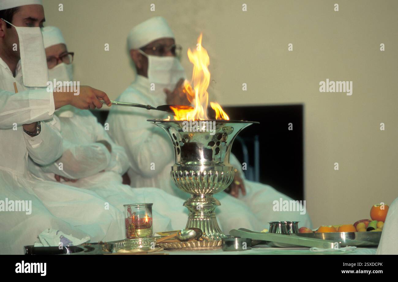 Priests burning sandalwood during the Zoroastrian Jashan ceremony Stock ...