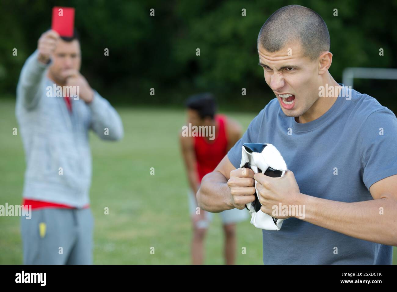 angry footballer getting a red card Stock Photo - Alamy