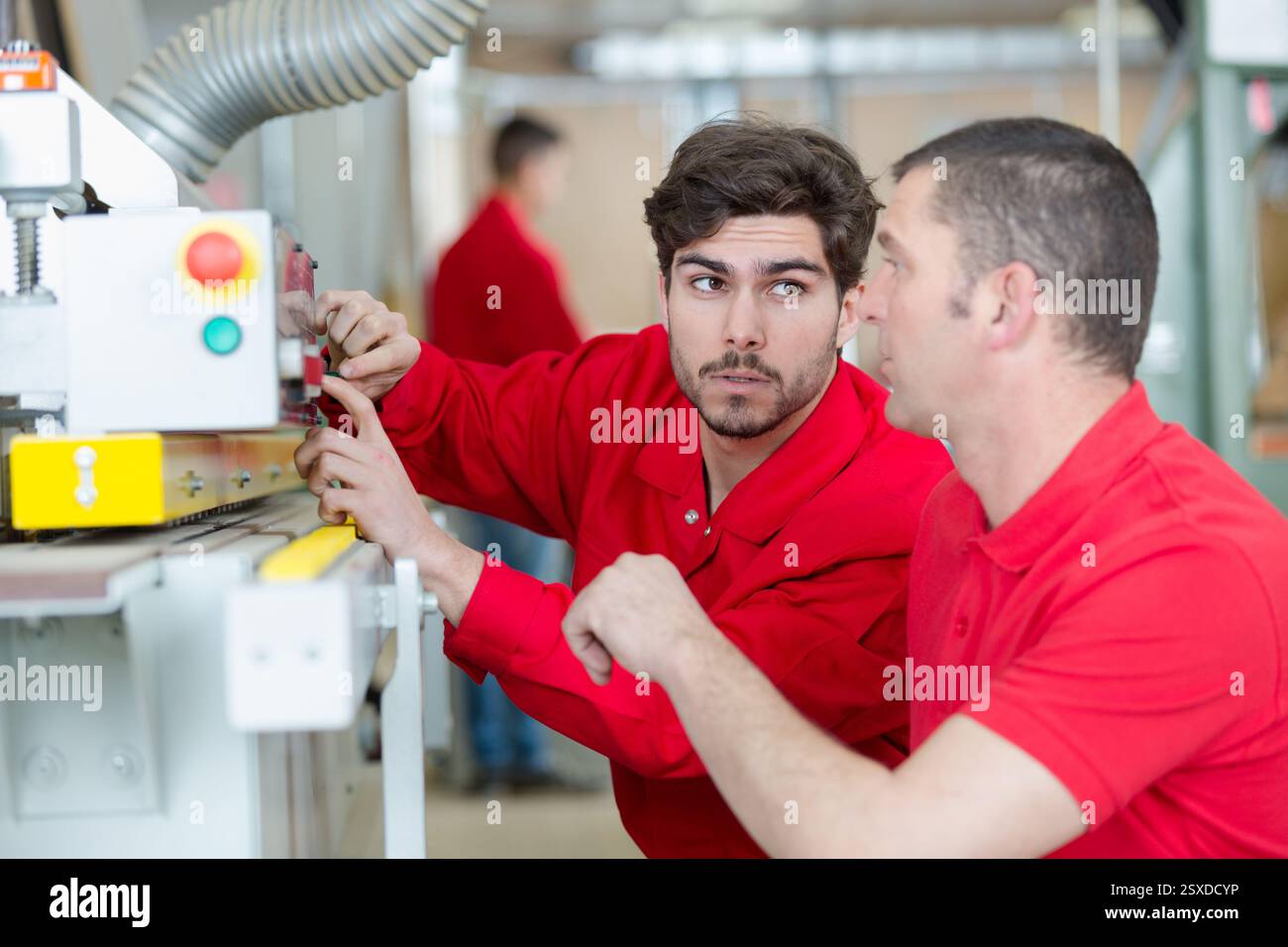 Worker pressing control button hi-res stock photography and images - Alamy