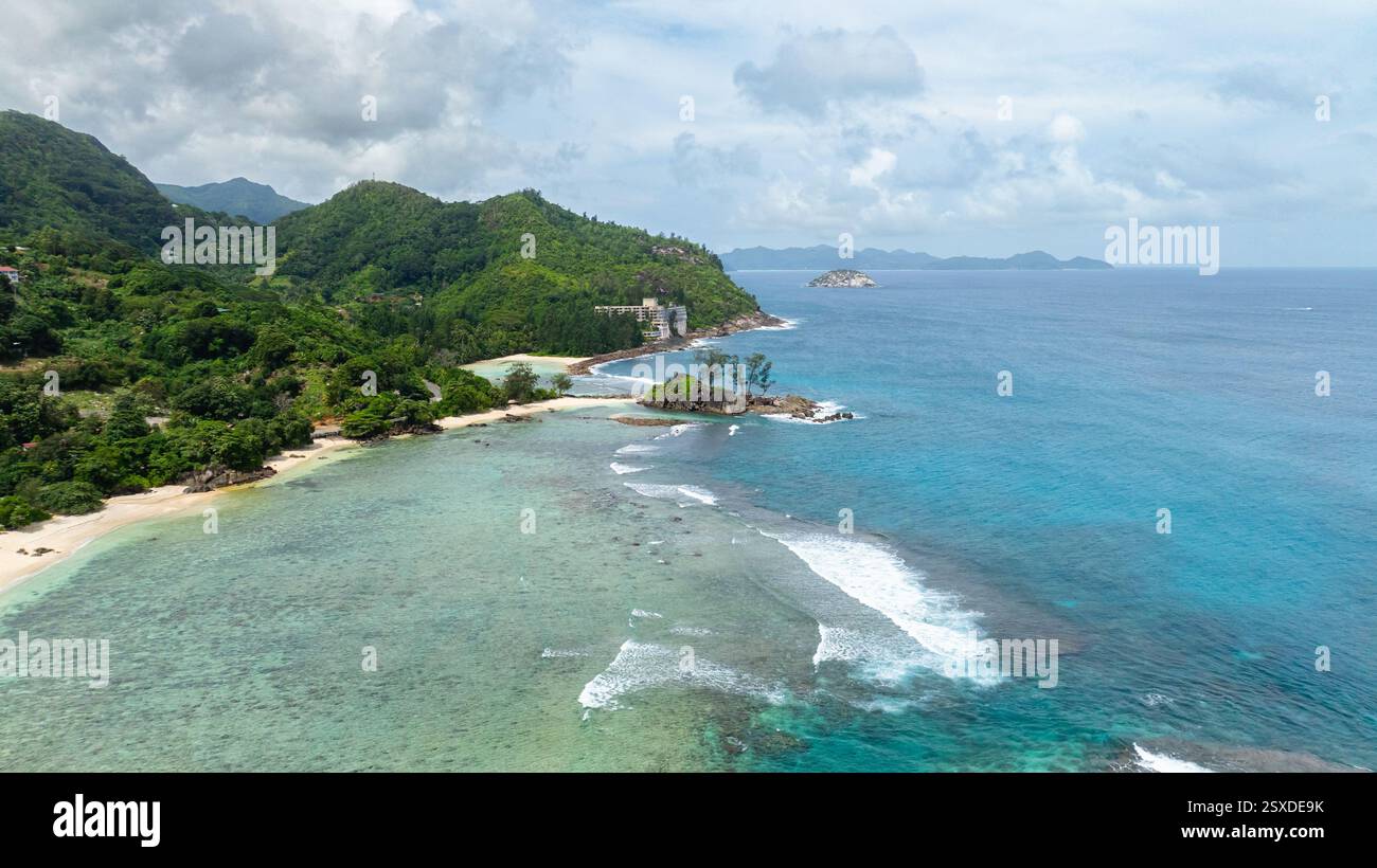 Sandy beaches, vibrant coral reefs and lush vegetation on Mahe Island ...