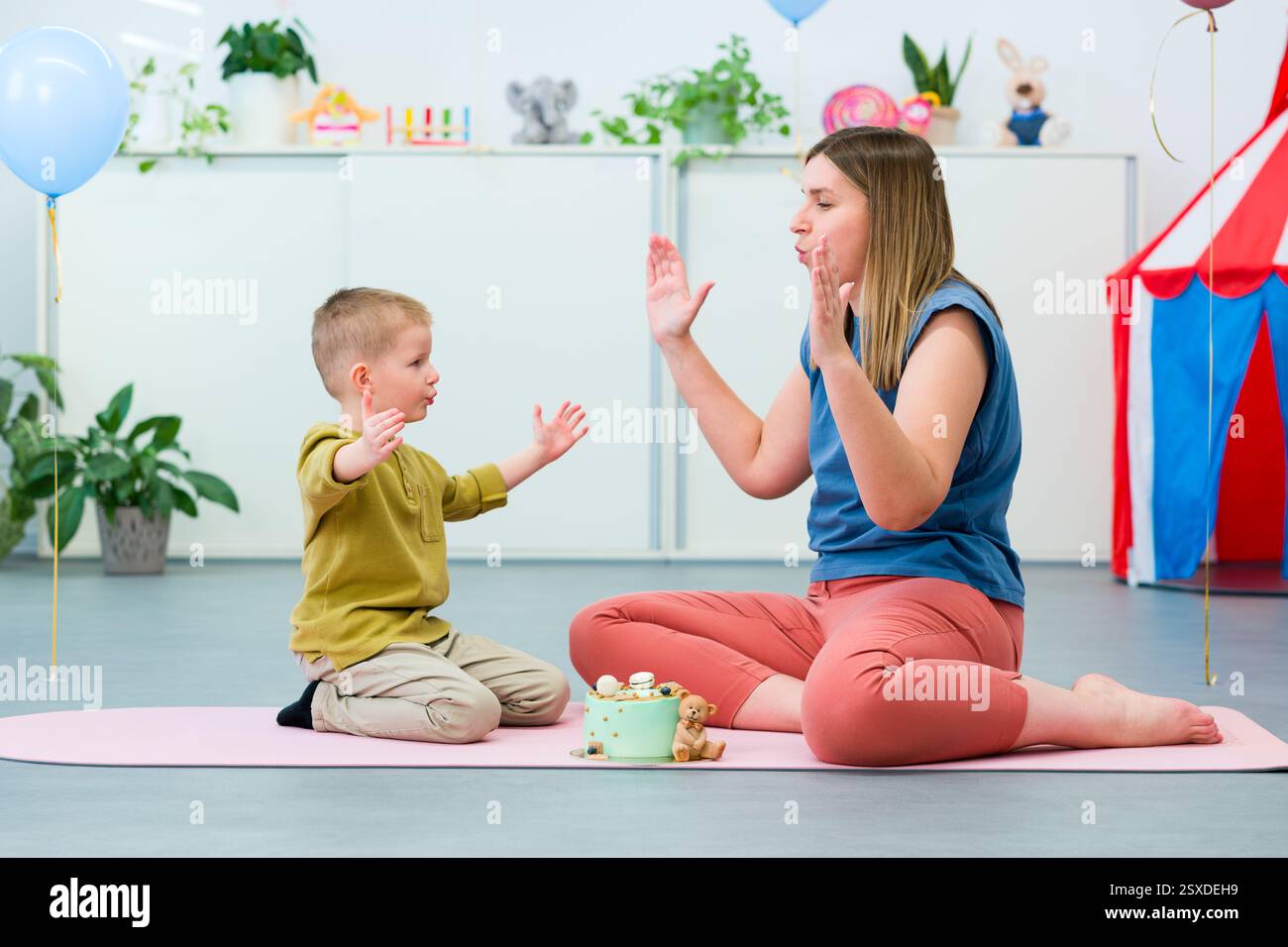 Baby Sign Language. Nonverbal child learning to sign with the help of a ...