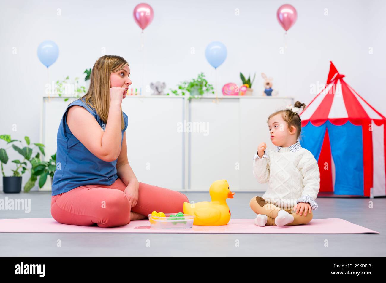Nonverbal child with Down syndrome learning baby sign language with the ...