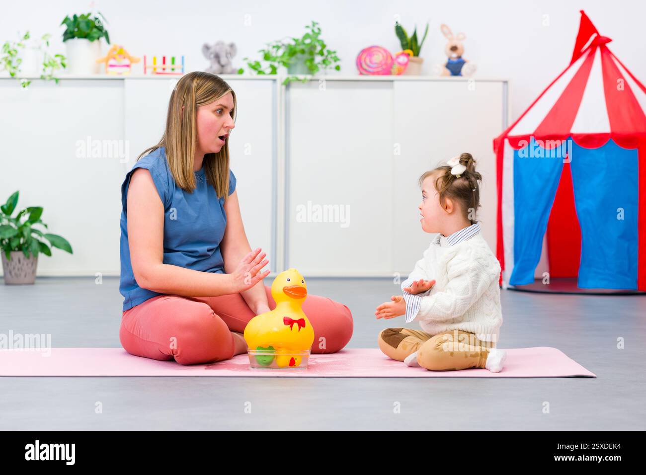 Nonverbal child with Down syndrome learning baby sign language with the ...