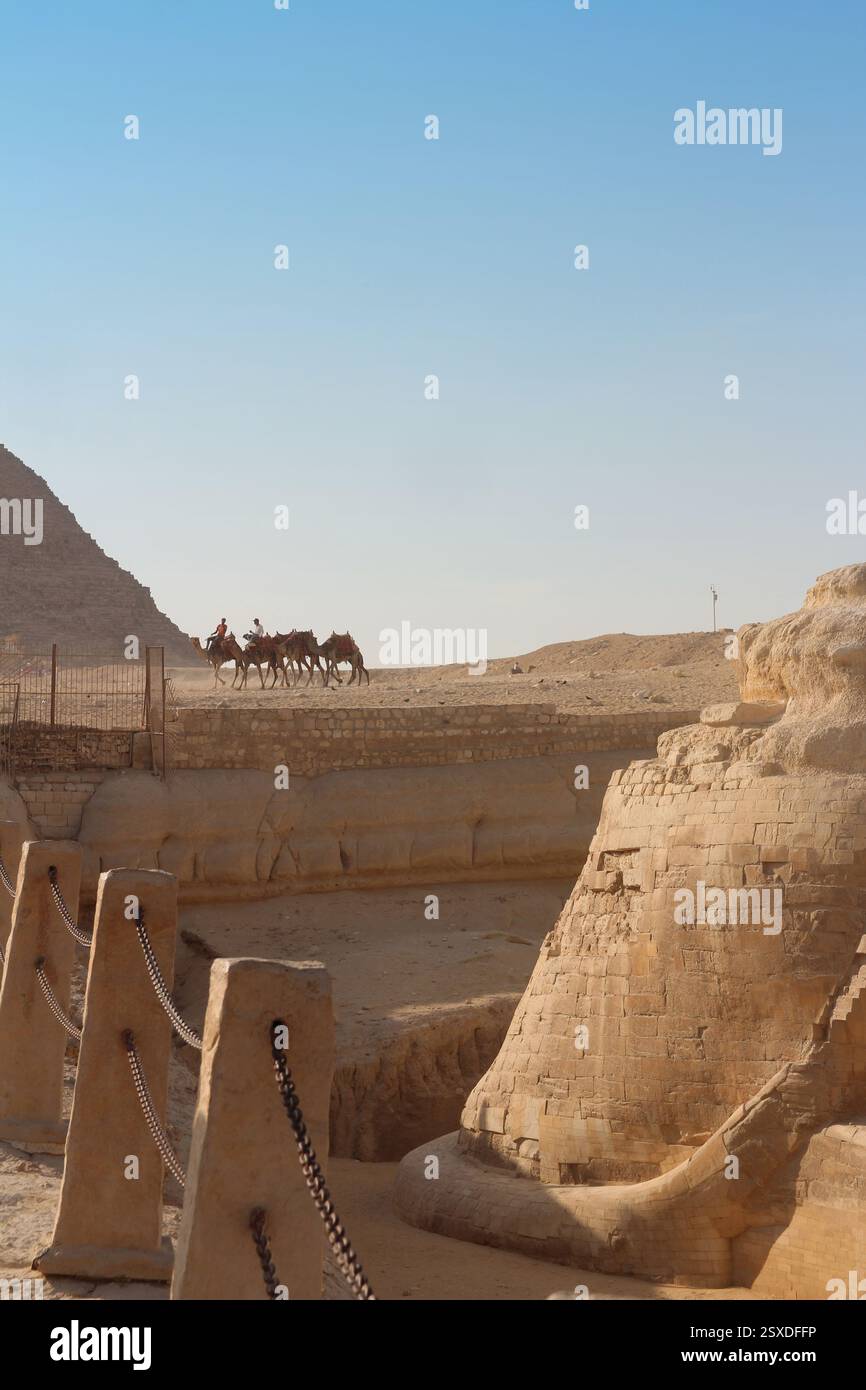 Camel riding at Pyramids of Giza in a sunny day near the Great Sphinx ...