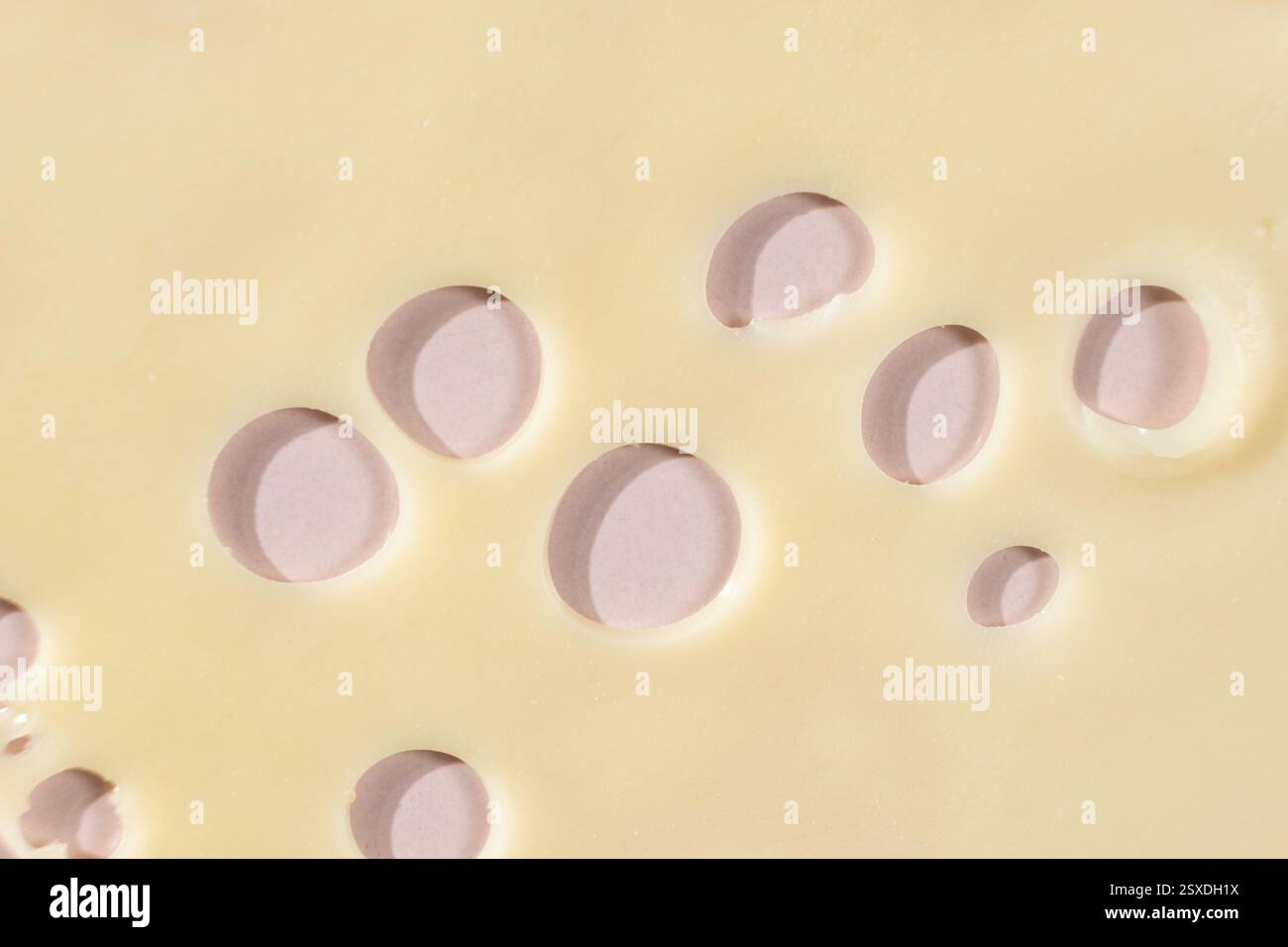 Smooth Yellow Cheese with Characteristic Holes Stock Photo - Alamy