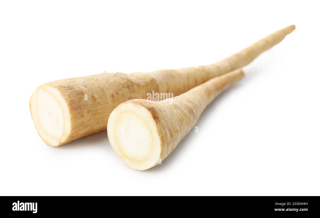 Cut fresh parsley roots isolated on white Stock Photo - Alamy