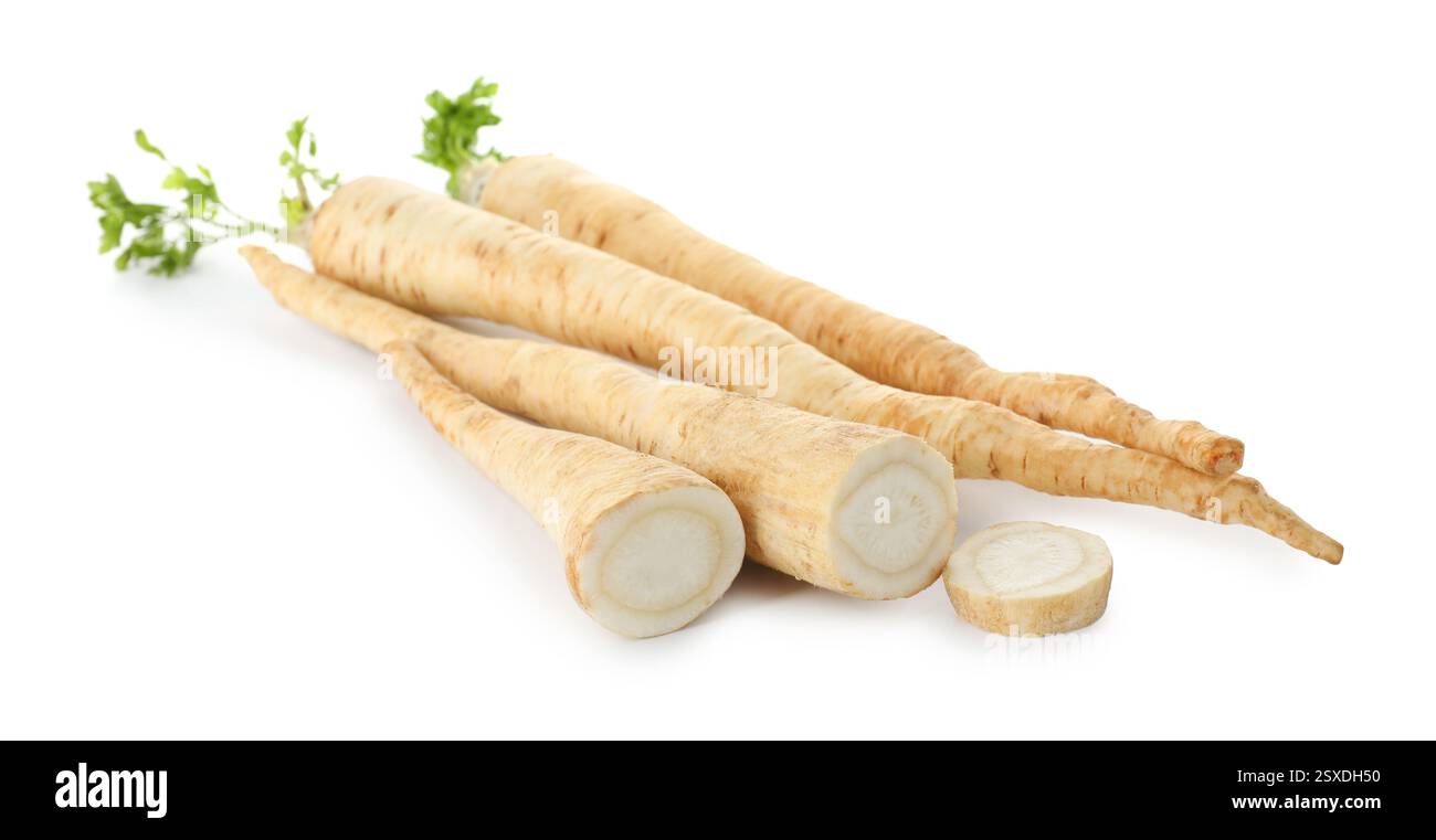 Whole and cut fresh parsley roots isolated on white Stock Photo - Alamy
