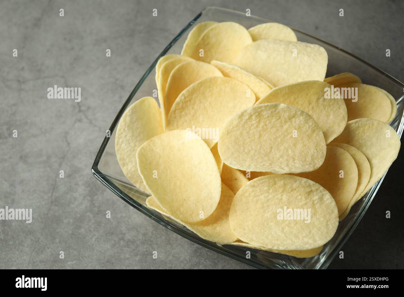 Potato chips on grey hi-res stock photography and images - Alamy