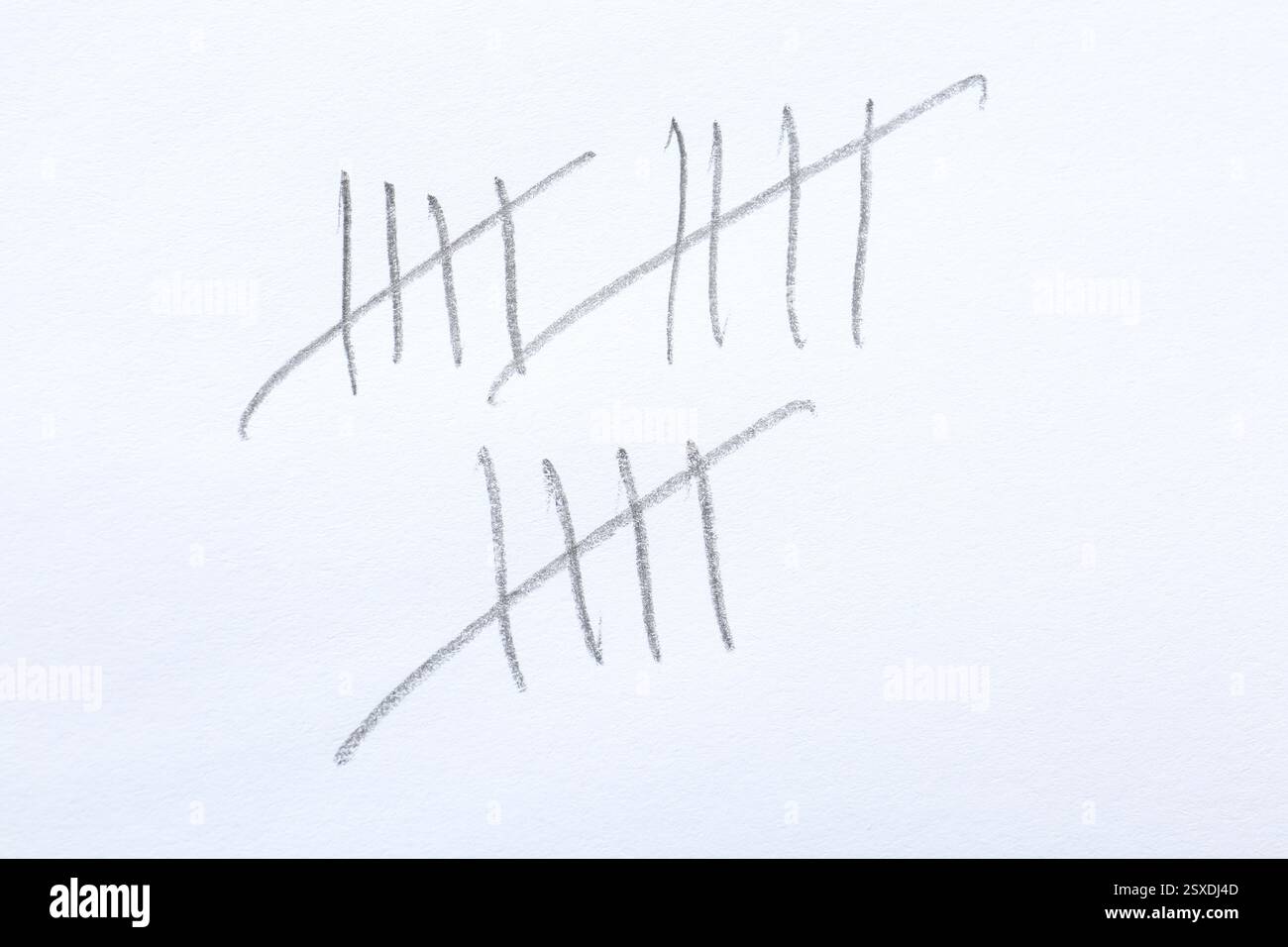 Counting days by drawing sticks with pencil on white background ...