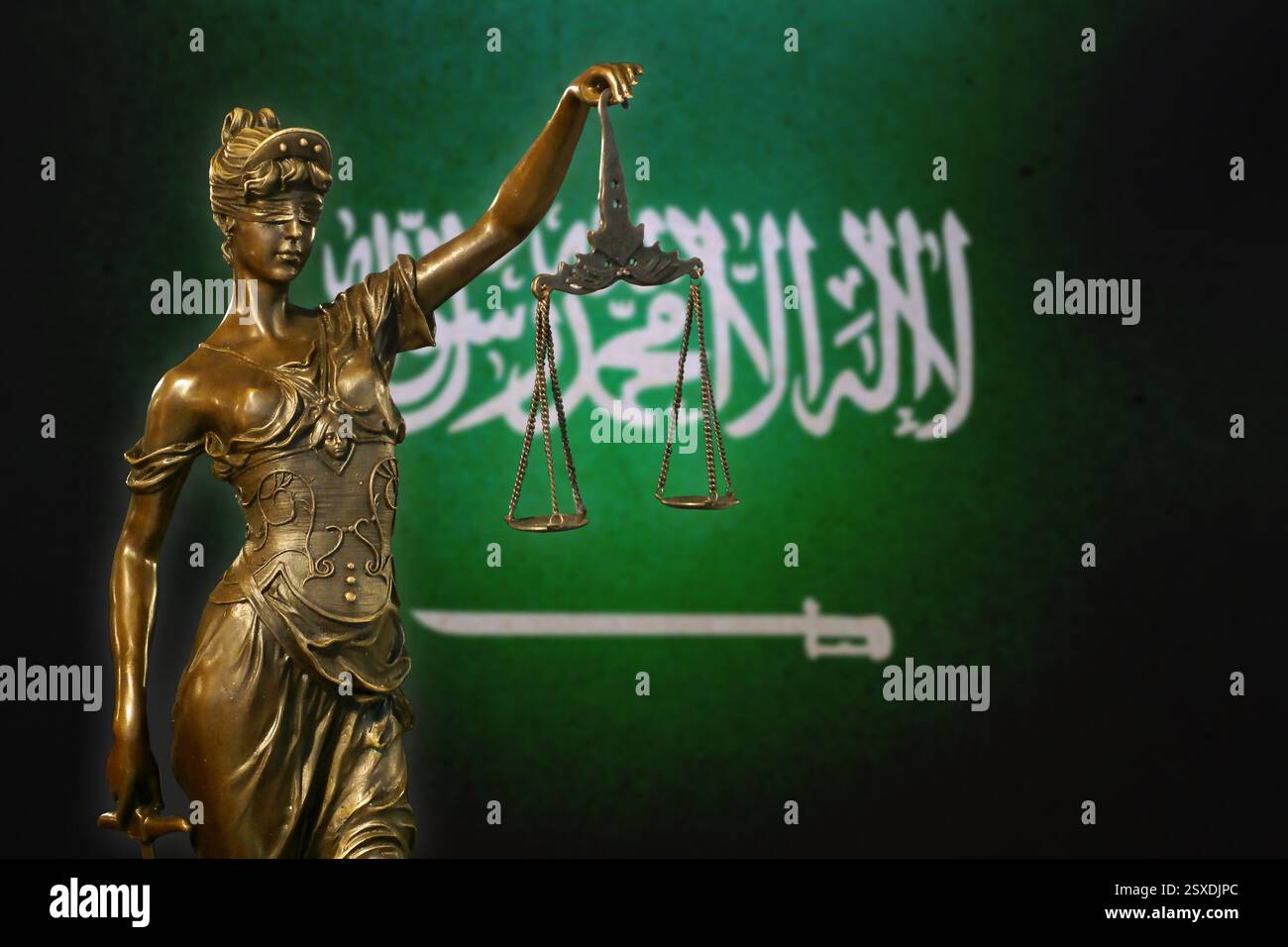 Close-up of a small bronze statuette of Lady Justice before a Saudi ...