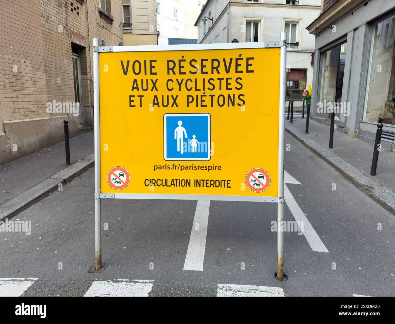 Cyclists and pedestrians enjoy designated path in bustling urban ...