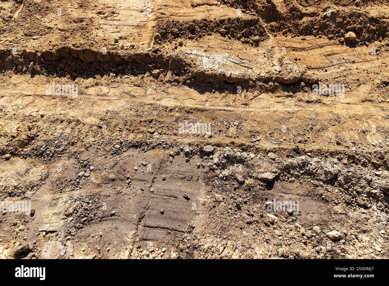 road construction work during the excavation of a pit for laying ...