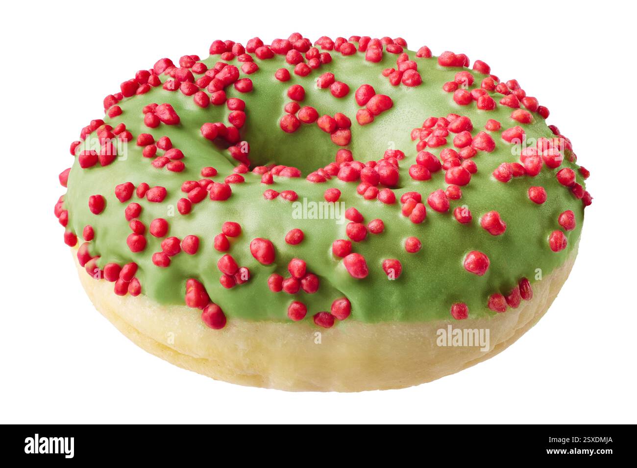 Single donut decorated with green icing and red sprinkles, close up shot, isolated on white ...