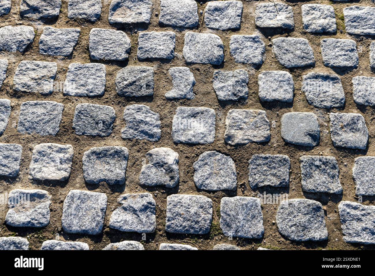 road made of cobblestones, pavement made of cobblestones of different ...