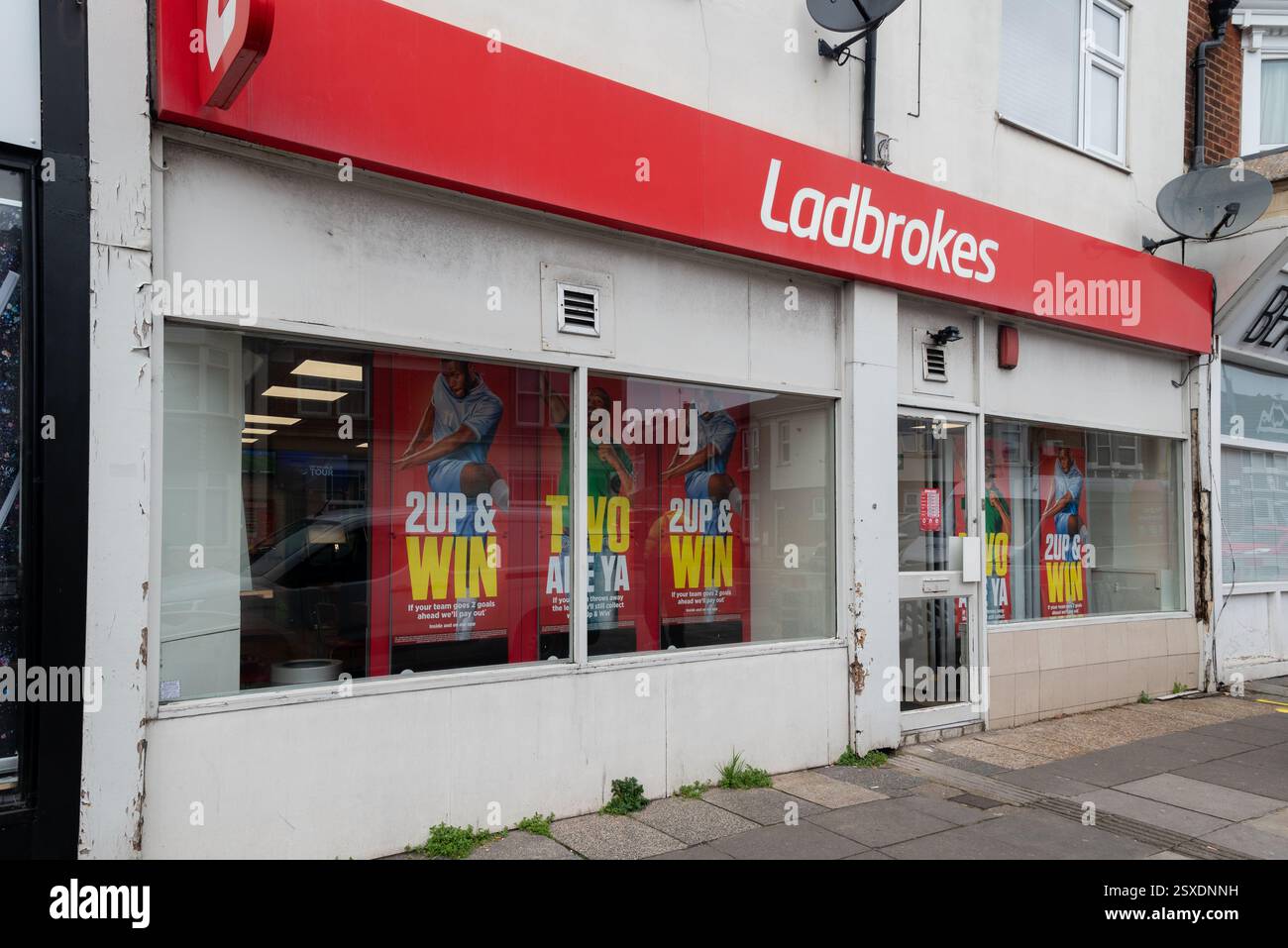 Store front and entrance to a Ladbrokes betting shop. February 2025 ...