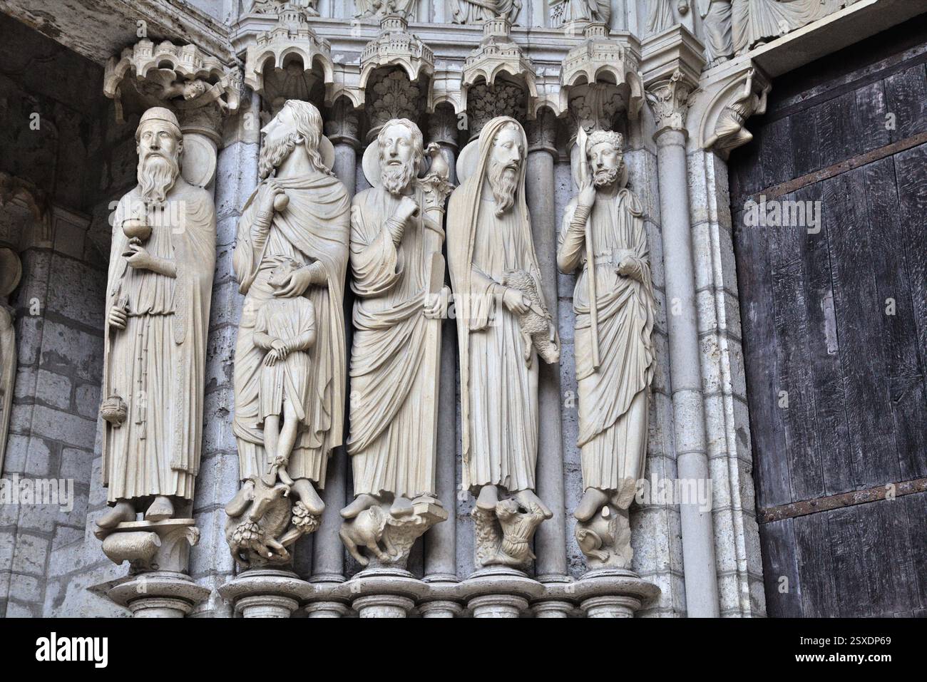 Visitors admire the intricate stone sculptures depicting biblical ...