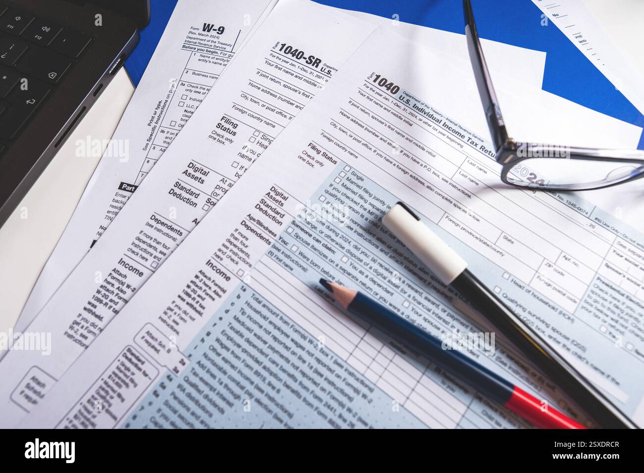 Accountant preparing tax form 1040 for tax season 2025 Stock Photo - Alamy