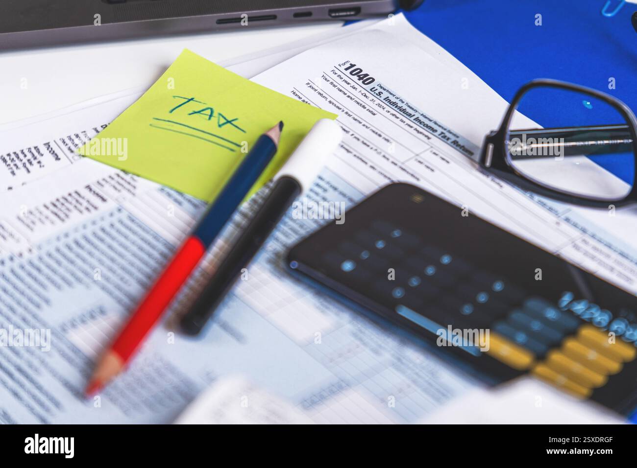 Accountant preparing tax form 1040 for tax season 2025 Stock Photo - Alamy