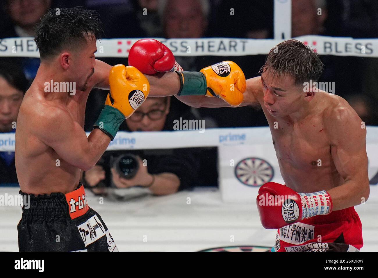 Daigo Higa , left, of Japan fight with Seiya Tsutsumi , right, of Japan during the WBA ...