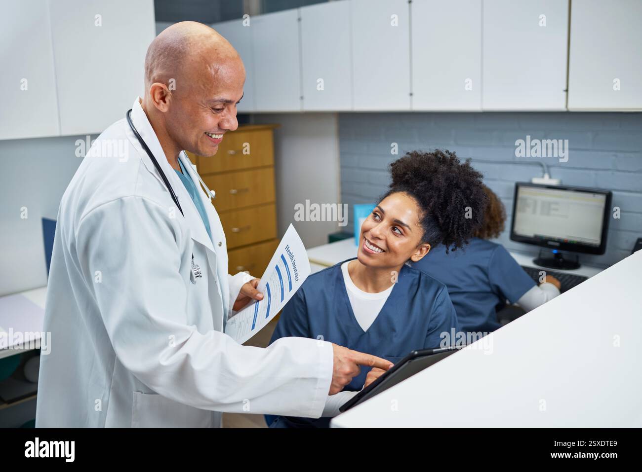 Healthcare Professionals Collaborating in a Modern Clinic Setting While ...