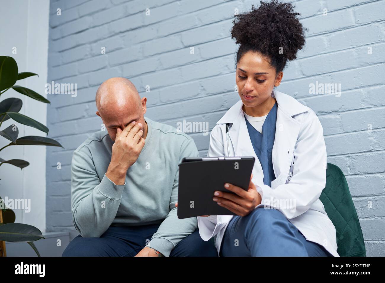 Doctor Providing Emotional Support to Male Patient Discussing Health ...