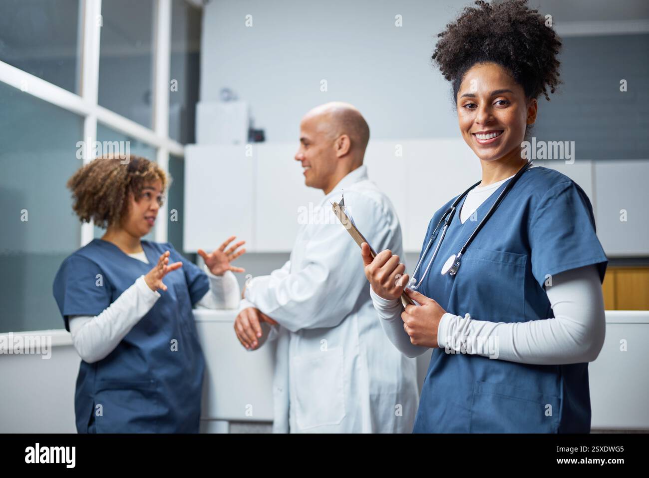 Healthcare Professionals Collaborating and Smiling in a Modern Medical ...