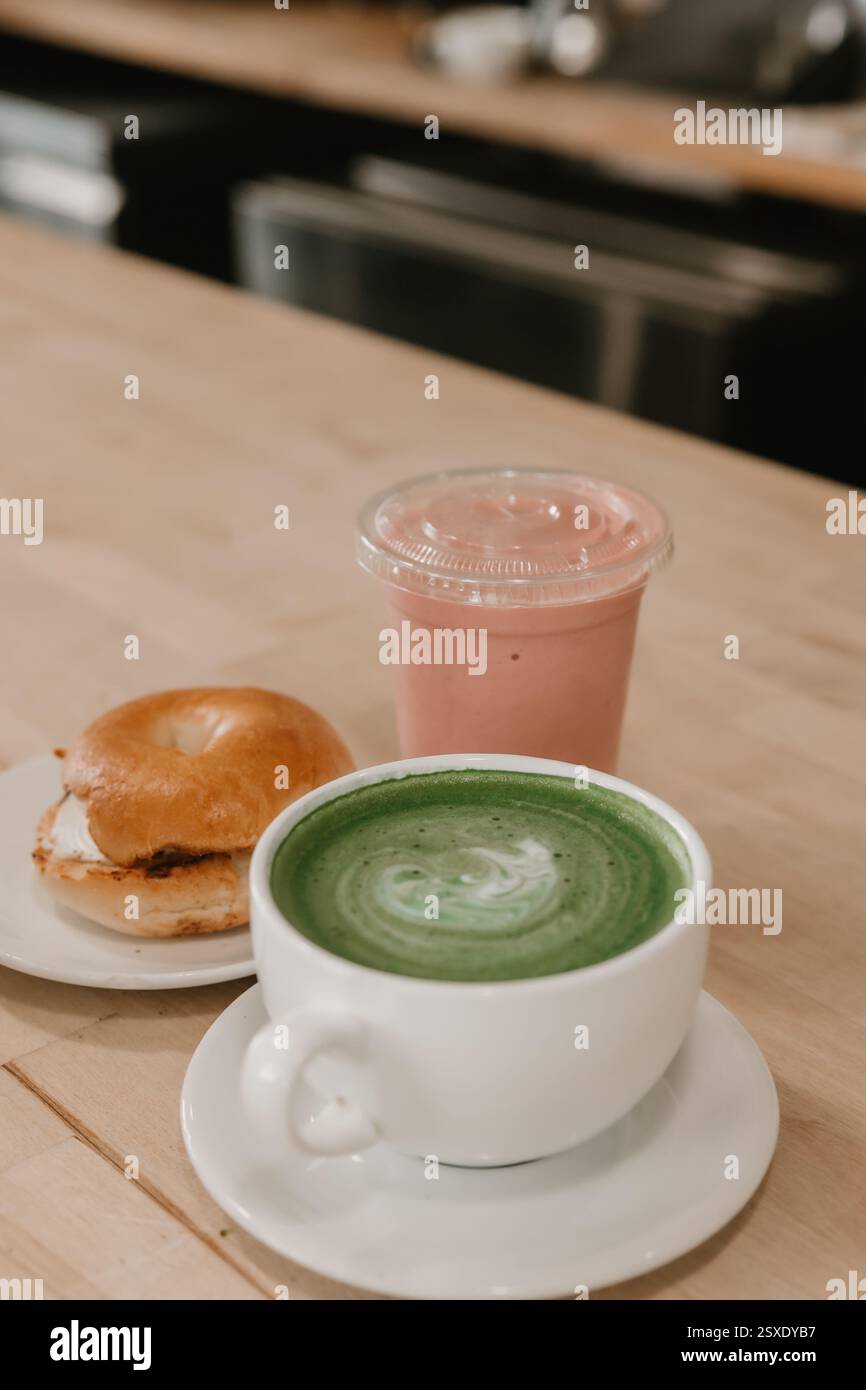 Matcha latte, strawberry smoothie, and bagel with cream cheese Stock ...