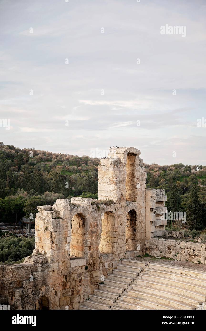 Ancient Odeon of Herodes Atticus with stone arches and steps Stock ...