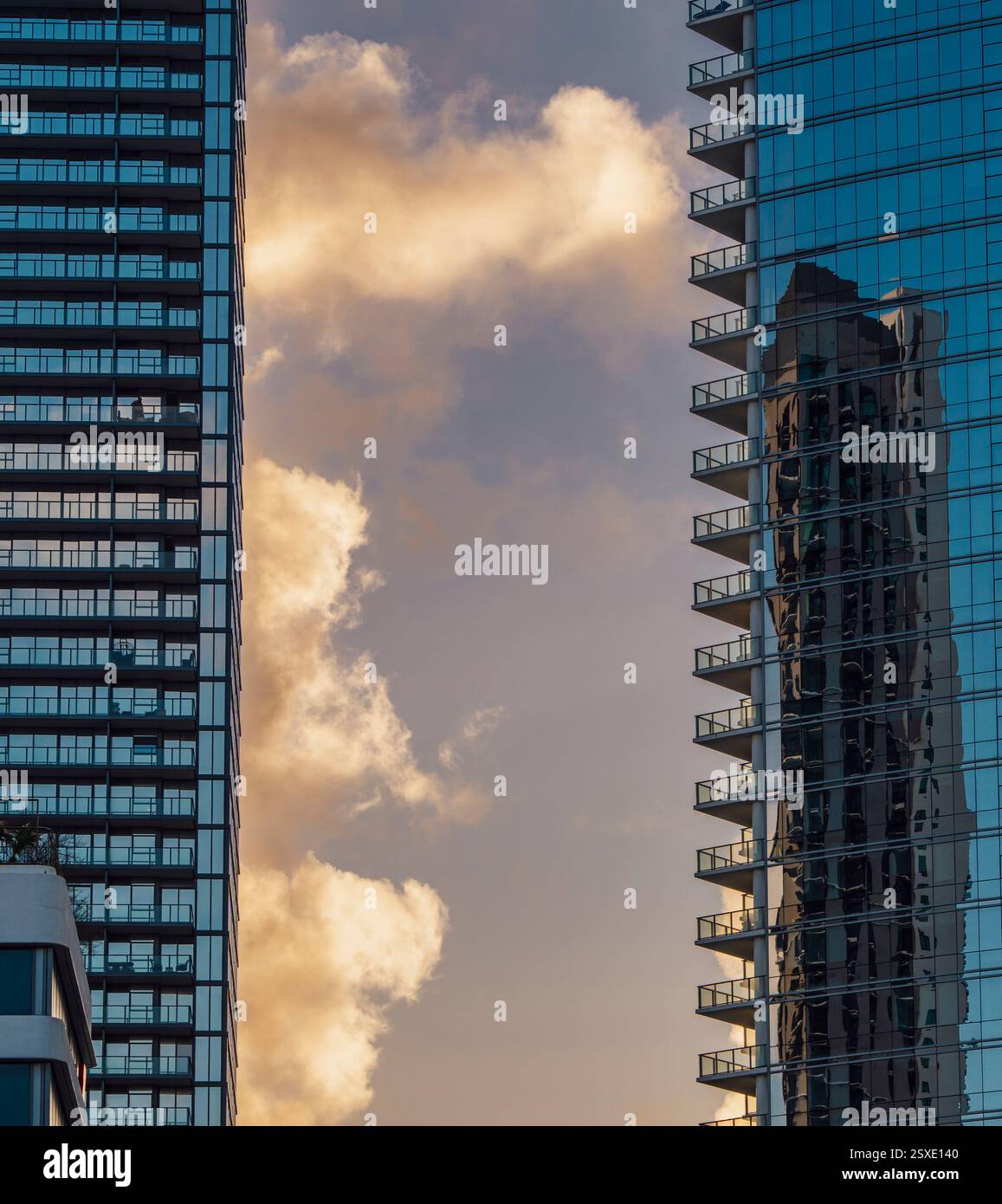modern office building in sunset sky clouds miami Stock Photo - Alamy