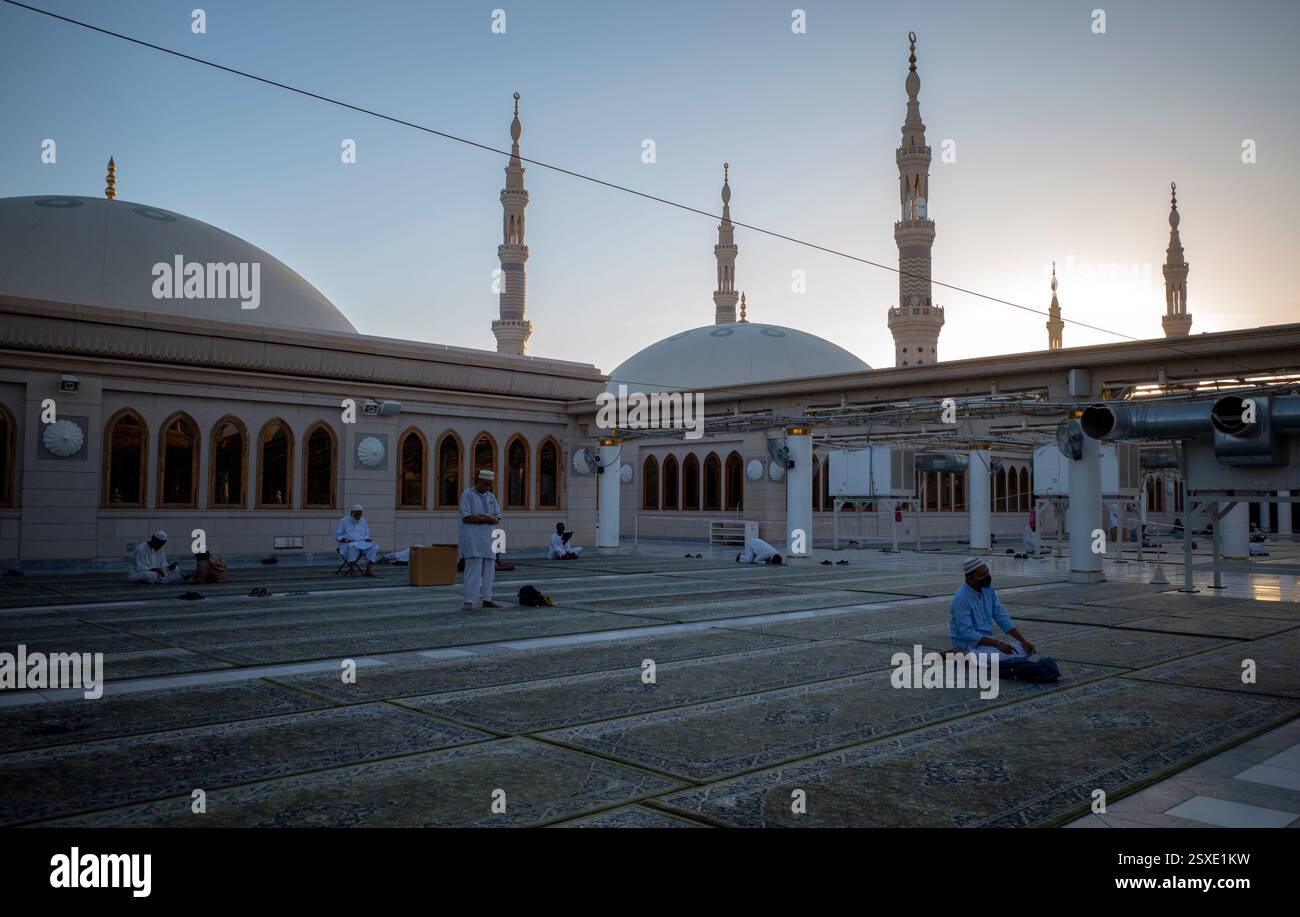 Medina, Saudi Arabia - July 3, 2024: A hajj pilgrim praying on the roof ...