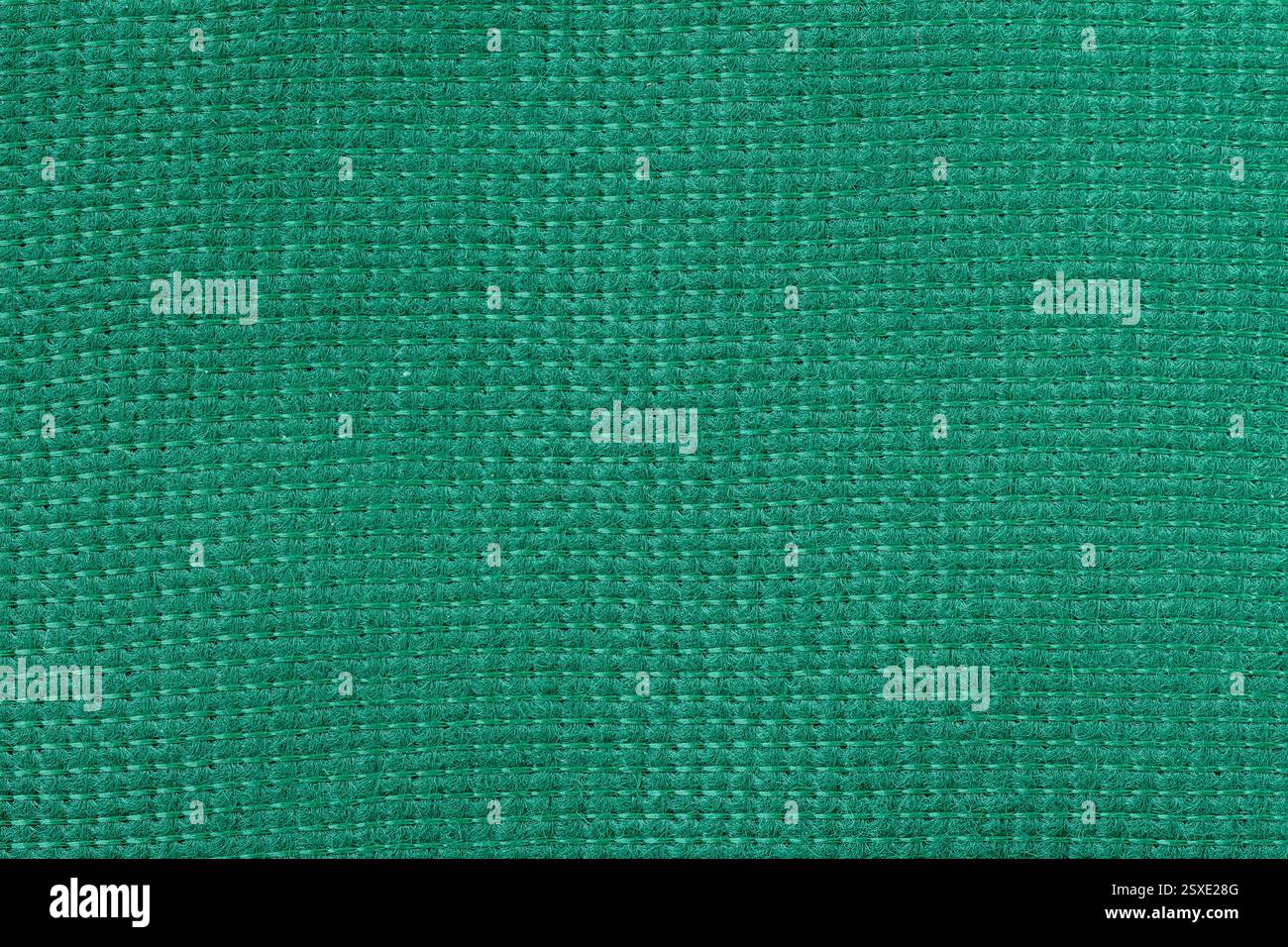 Green woven fabric texture with a tight grid pattern and detailed ...