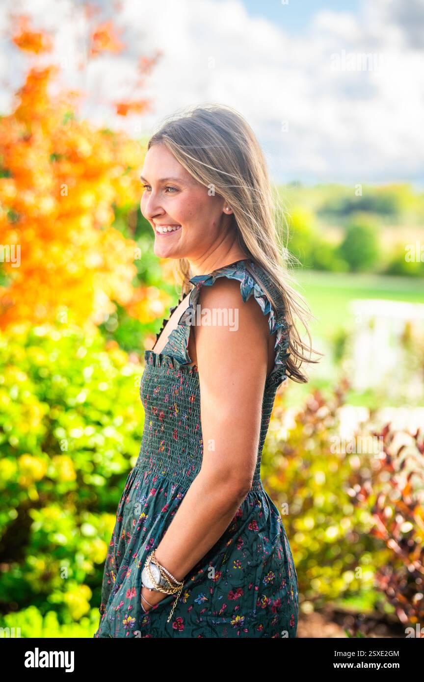 Beautiful Mom with Highlights Wearing Dress in her Home Backyard Stock ...