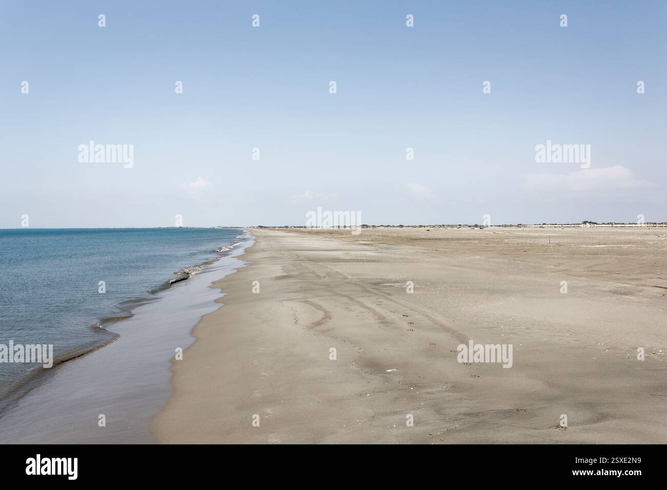 Beach with very calm sea on a sunny summer day in the Camargue, France ...