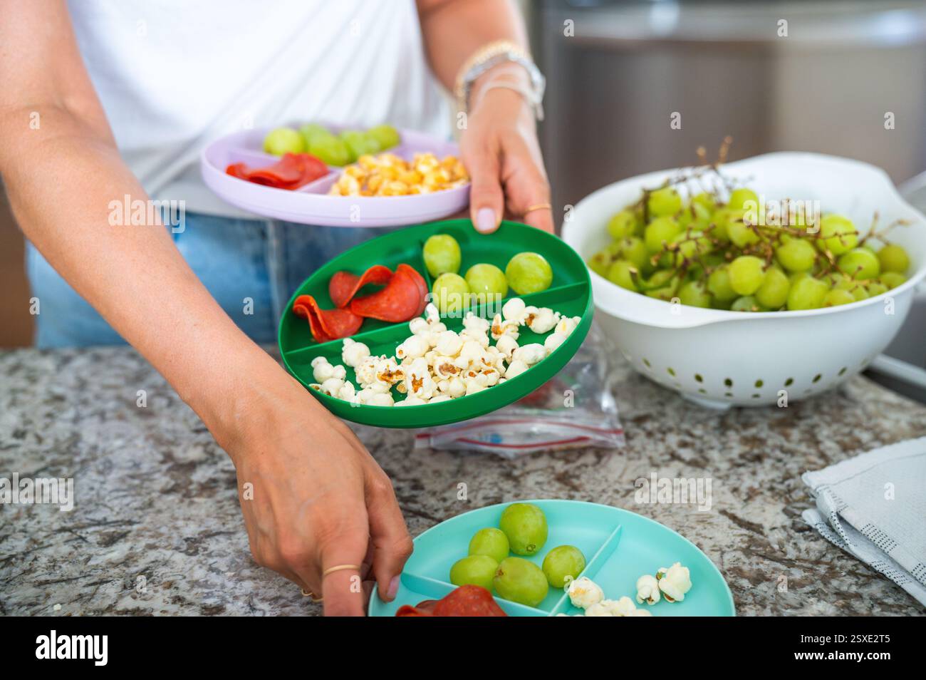 Mom Preparing After-School Snack in Kitchen for Kids Stock Photo - Alamy