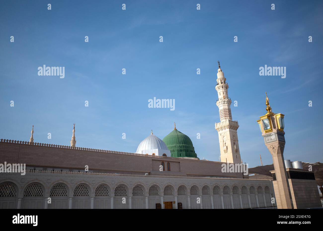 A green dome and minarets in Prophet Mosque in Madinah, also known as ...