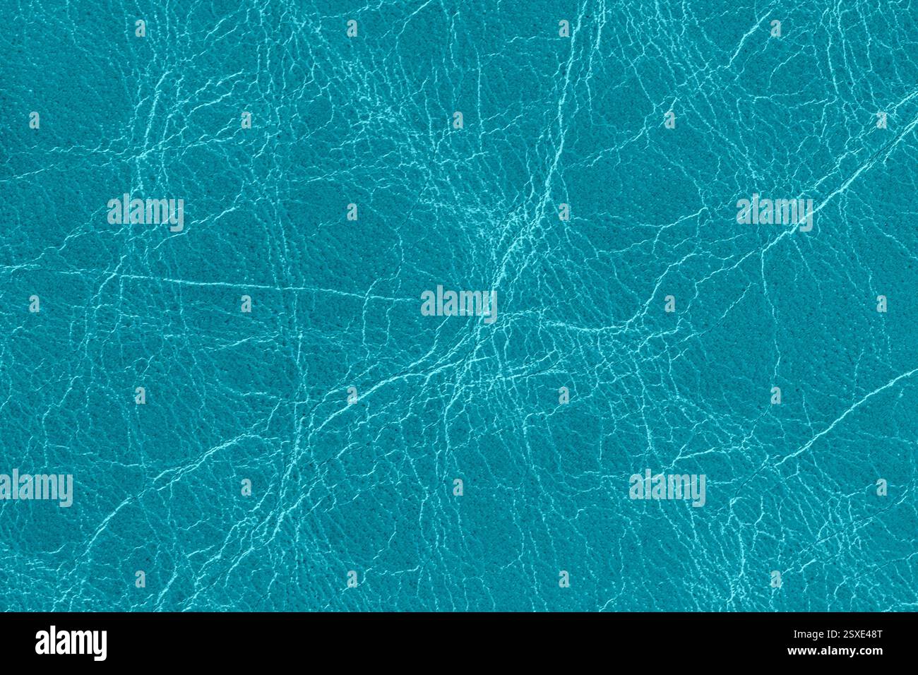 Turquoise cracked leather texture with intricate vein-like patterns and ...