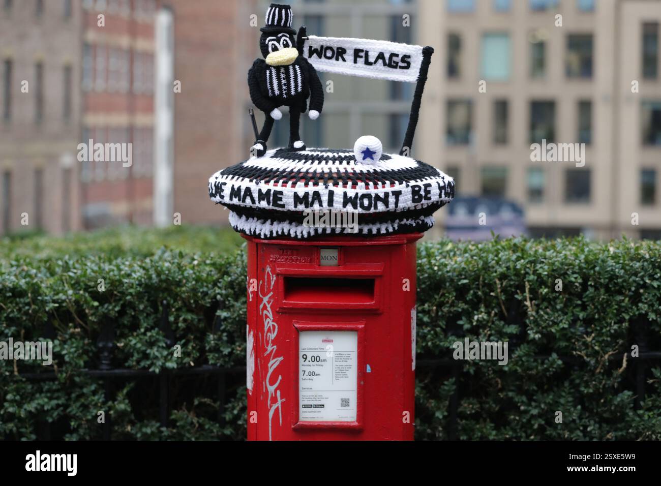 A Royal Mail post box is adorned by a Knitted Wembley Tribute ...