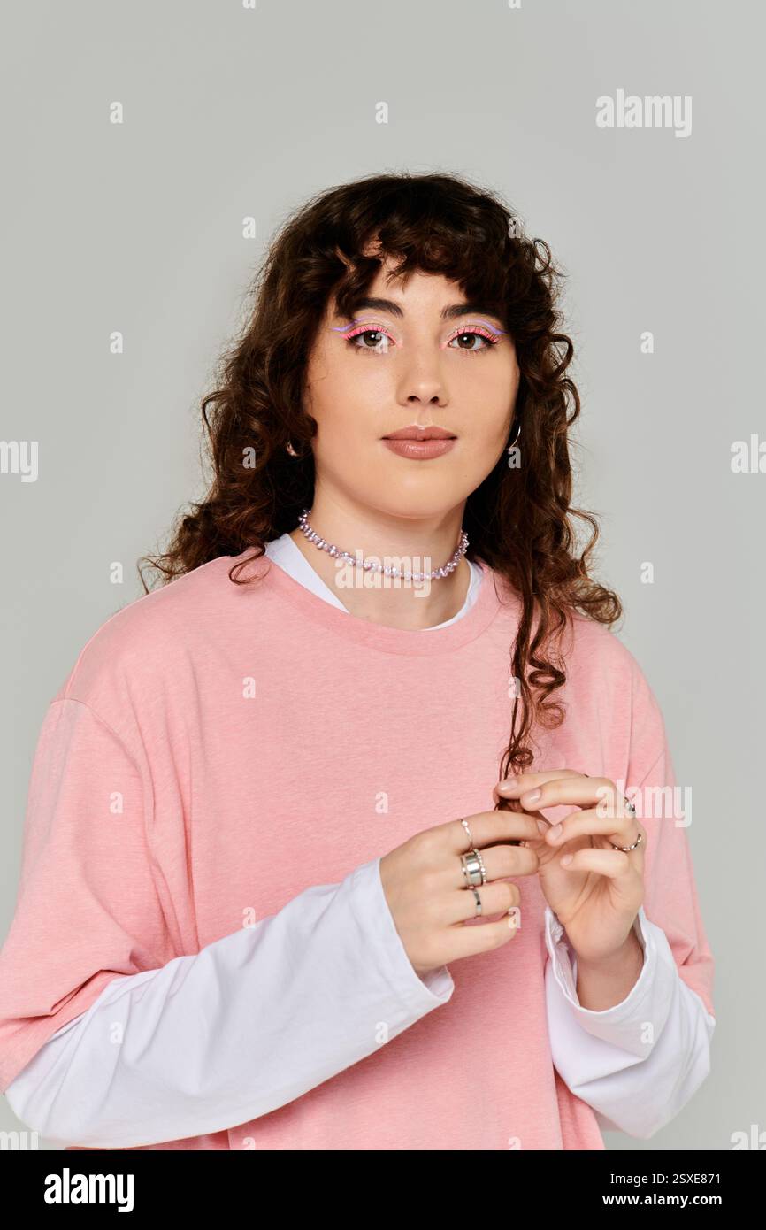 Chic young woman showcases emotions while posing in a sleek, minimalist ...