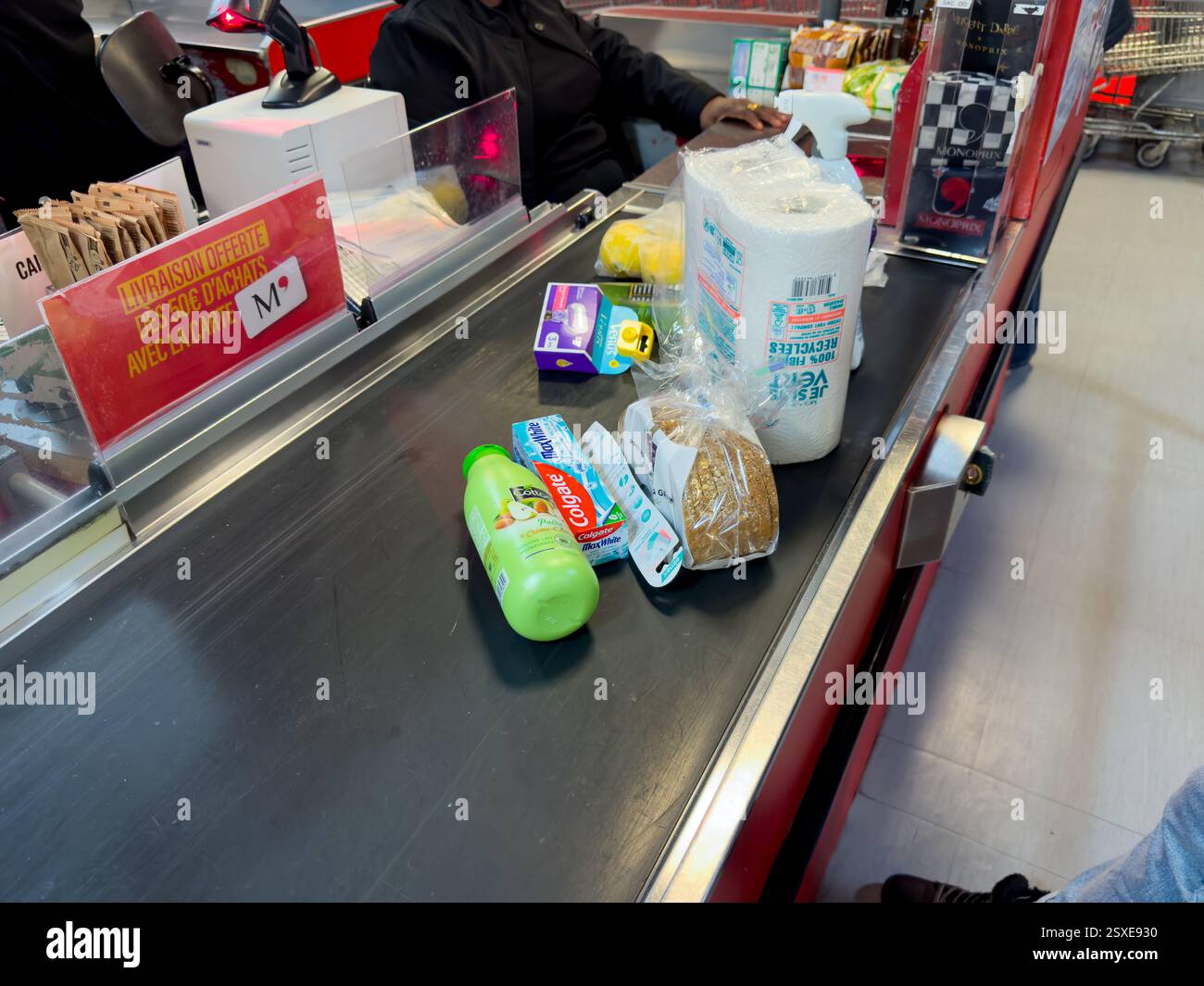 Grocery shopping experience at a bustling supermarket checkout lane ...