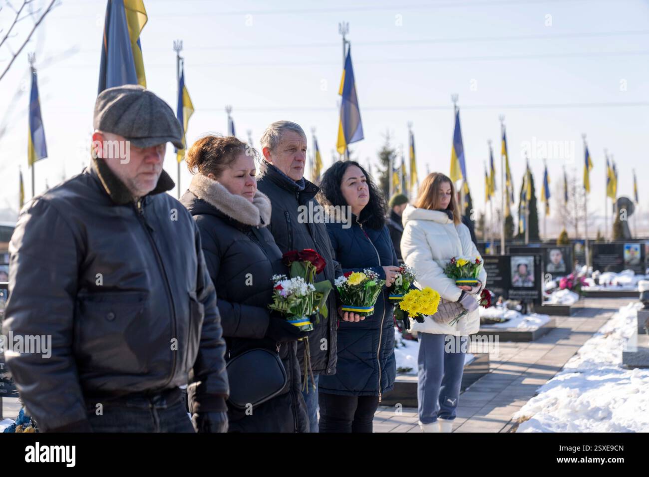 Bucha, Ukraine. 24th Feb, 2025. People gather for a ceremony on the 3rd ...