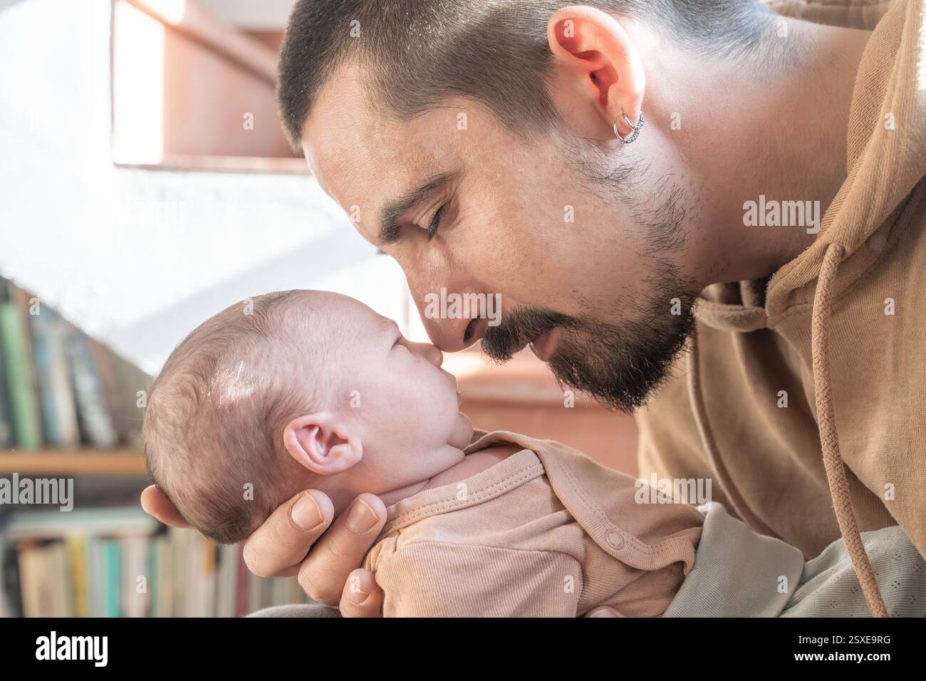 A Tender Moment Shared Between Father and His Baby A Deeply Heartwarming Connection Stock Photo ...