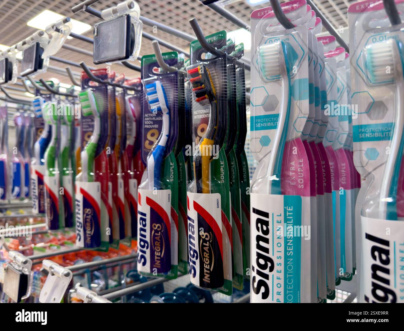 Colorful array of toothbrushes brightens grocery aisle in modern store ...