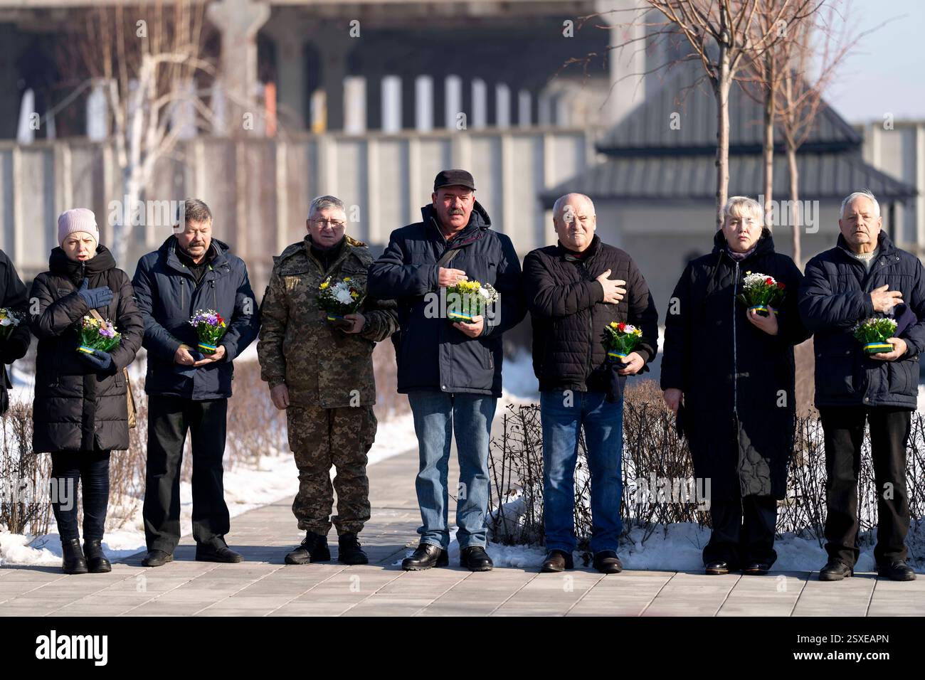 People gather for a ceremony on the 3rd year anniversary of Russia ...