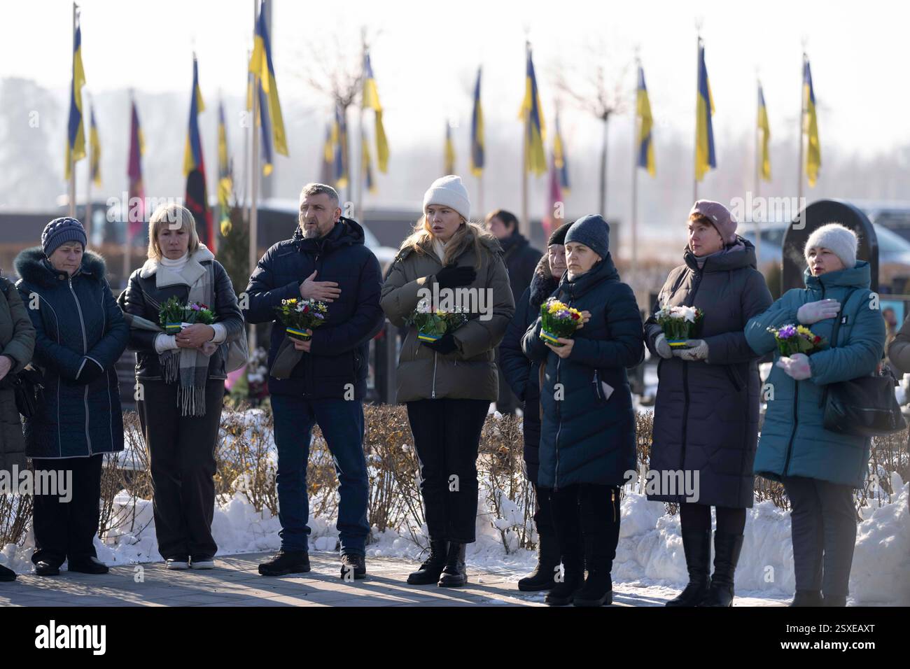 People gather for a ceremony on the 3rd year anniversary of Russia ...