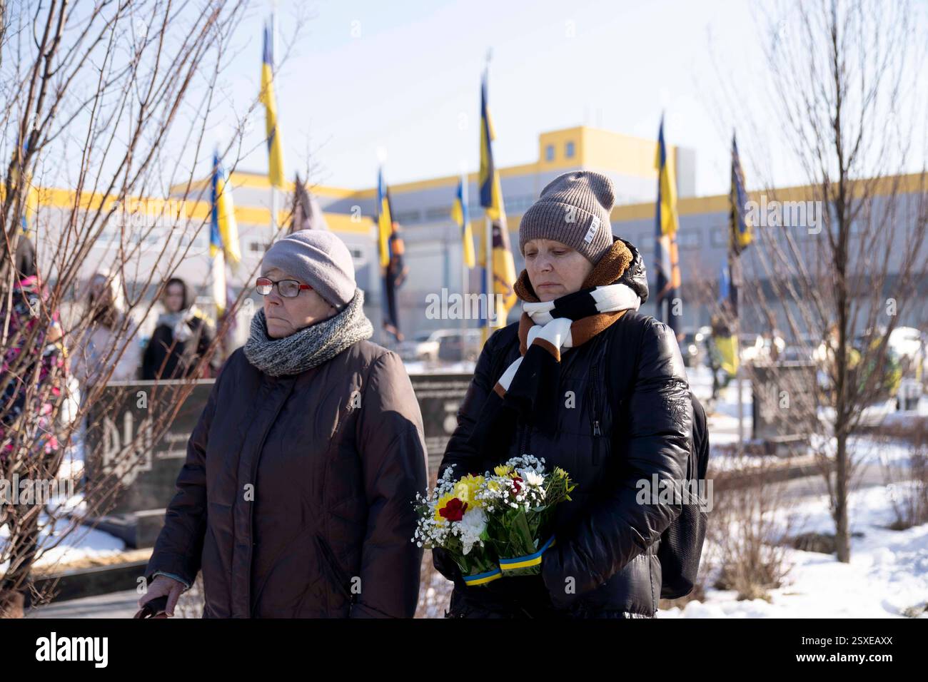 People gather for a ceremony on the 3rd year anniversary of Russia ...