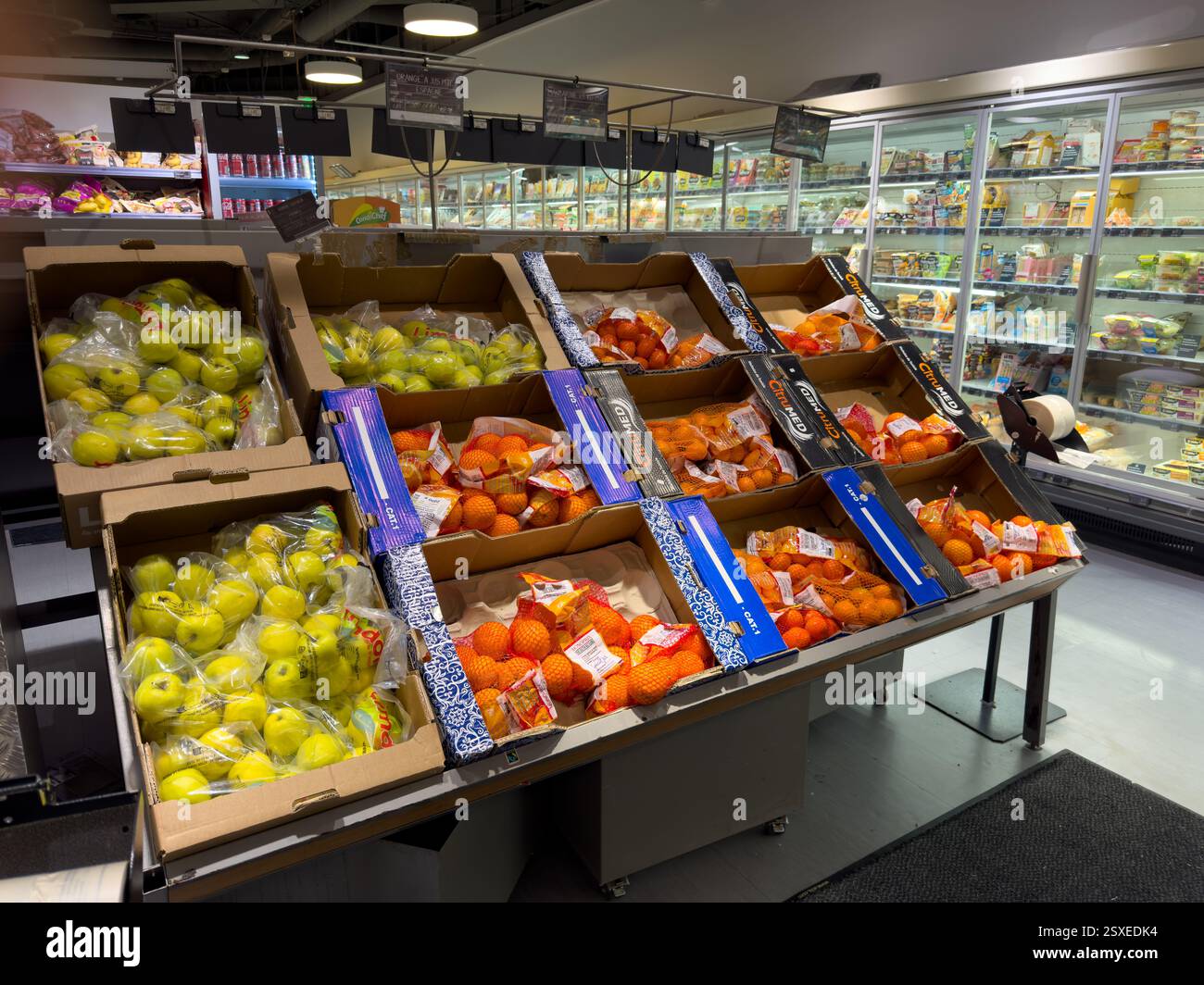 Fresh fruits displayed elegantly in a vibrant grocery store aisle Stock ...